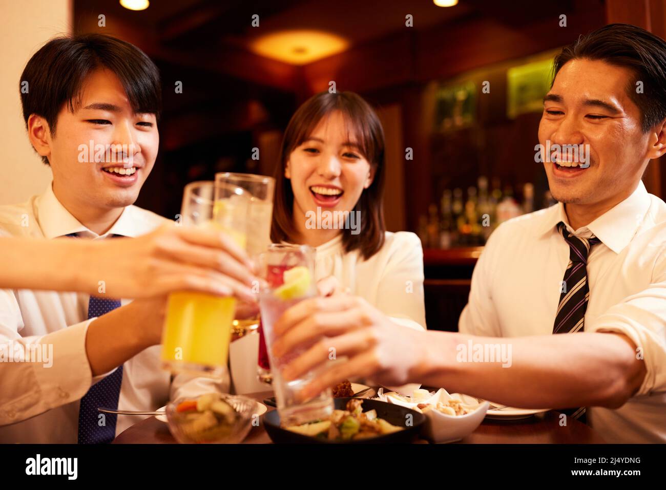 Japanese businesspeople having drinks and dining at a bar Stock Photo ...