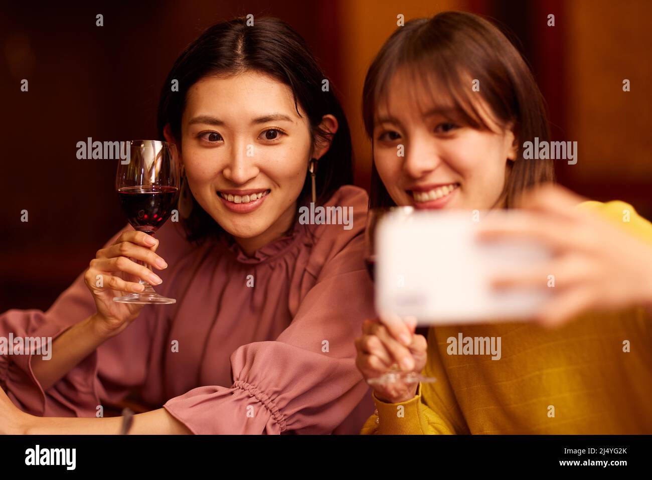 Japanese friends having a drink at a bar counter Stock Photo - Alamy