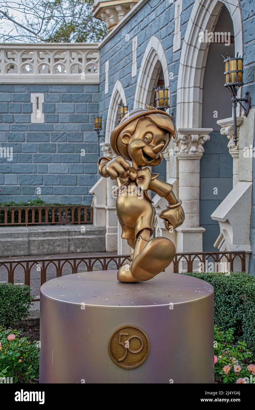 Pinocchio Gold Statue 50th Anniversary Disney Magic Kingdom Stock Photo ...