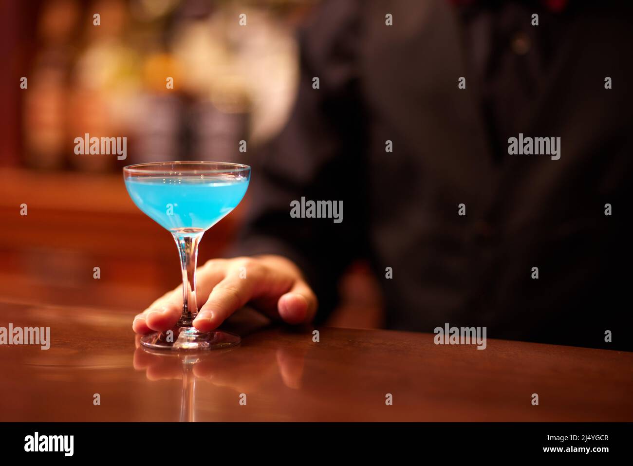 Japanese bartender serving a drink Stock Photo - Alamy