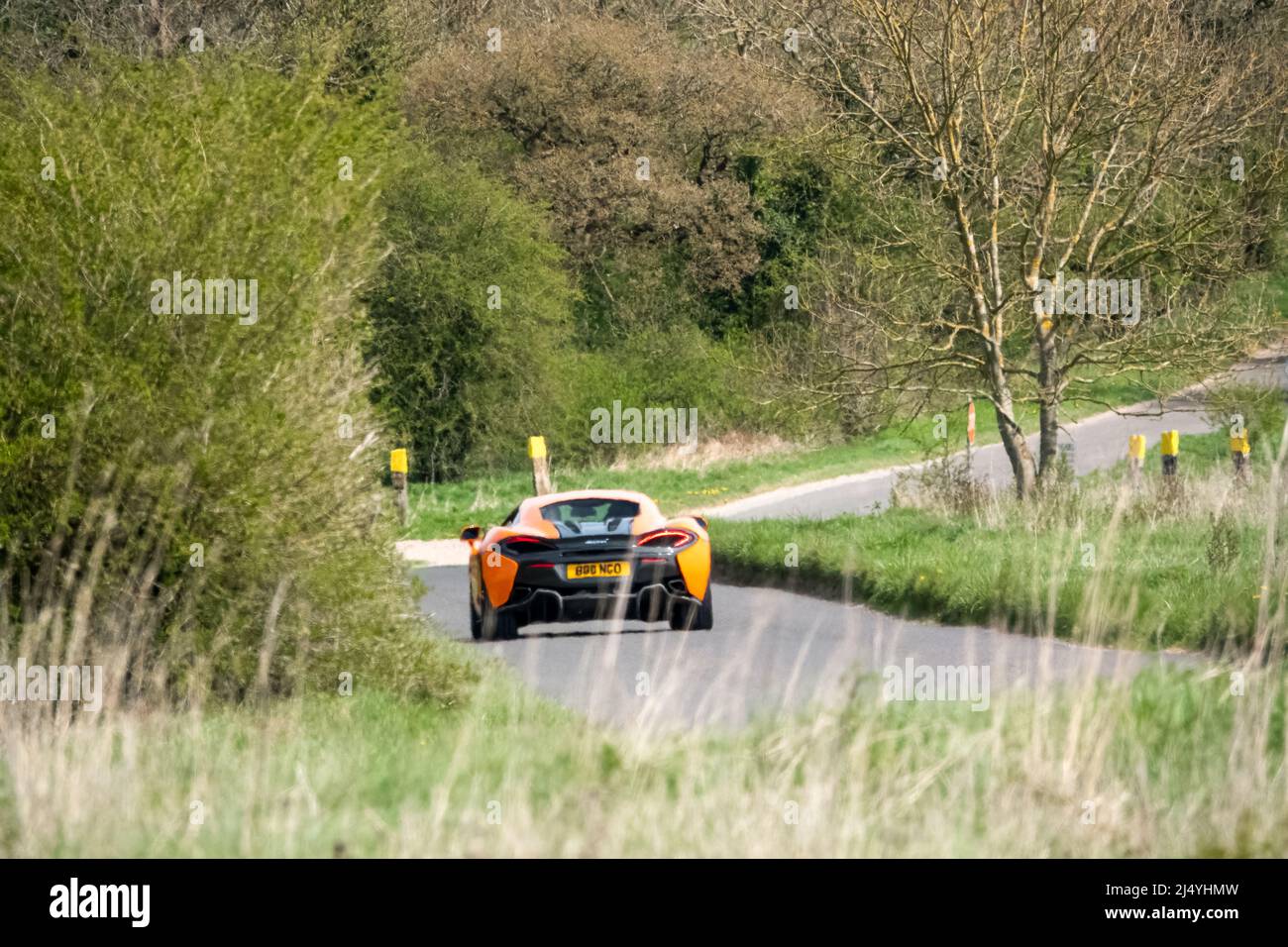 large dark red coach work horse transport lorry in motion through open ...