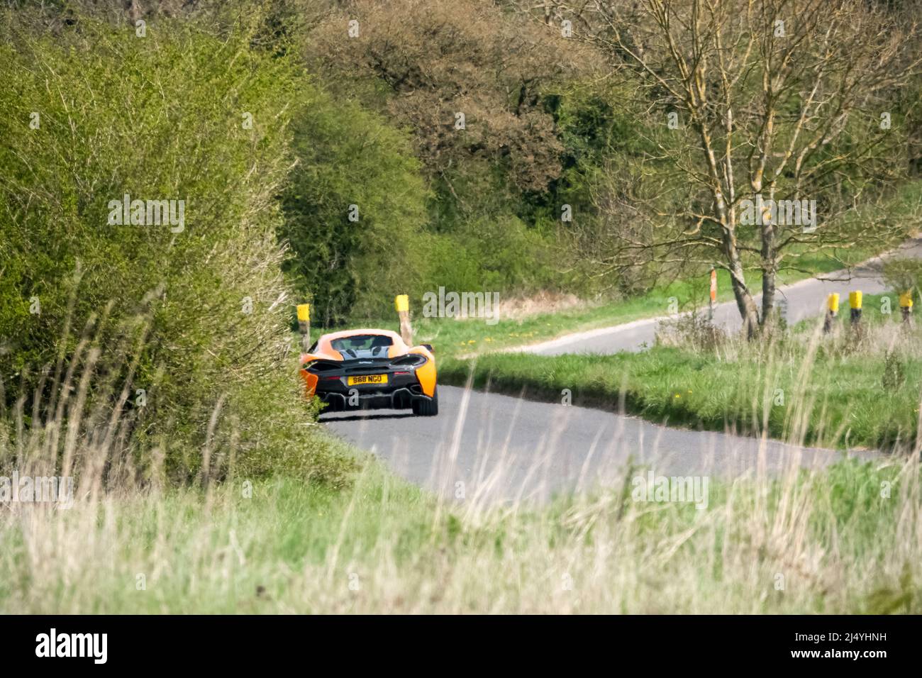 large dark red coach work horse transport lorry in motion through open ...