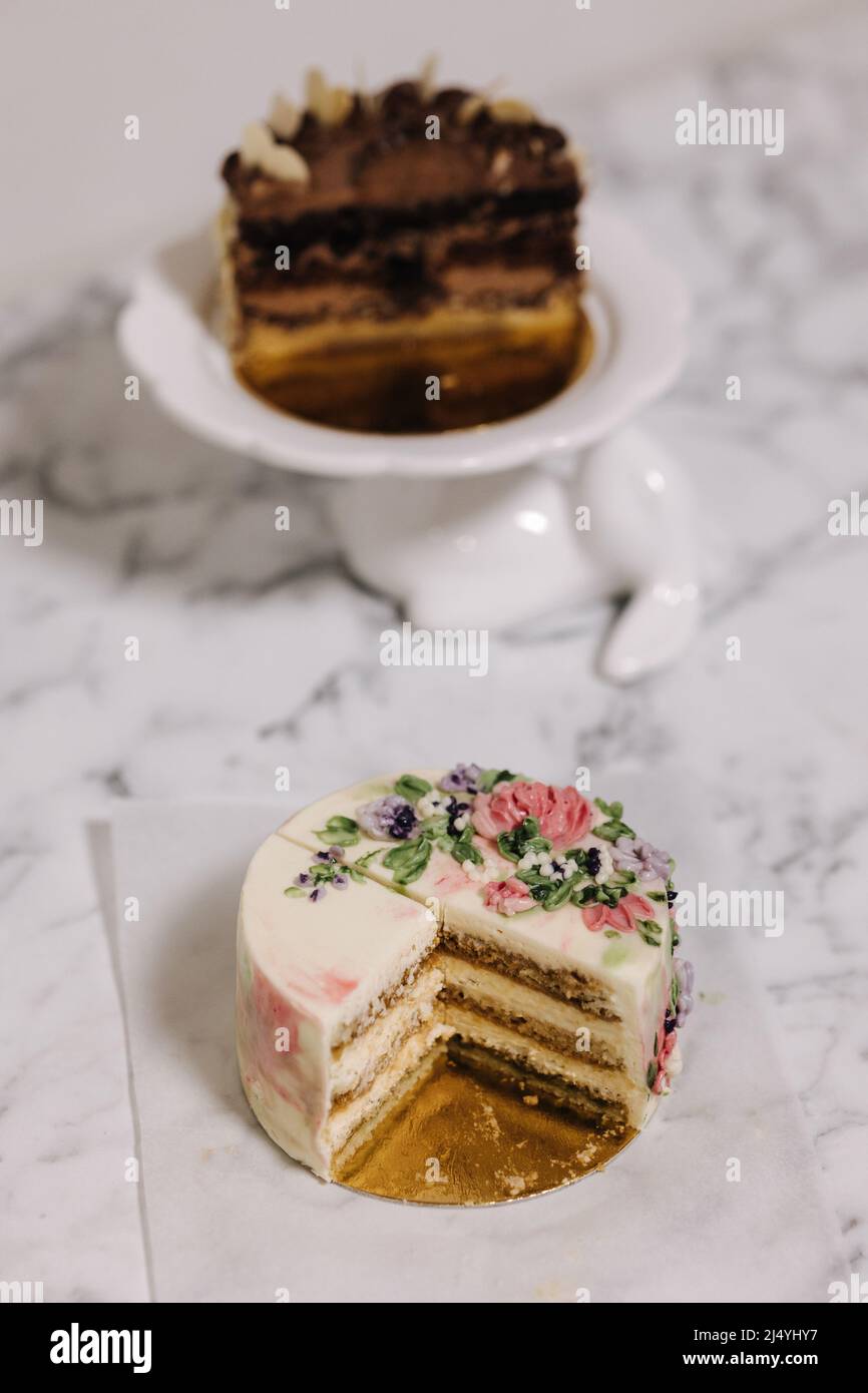 Slice of tiramisu bento cake. Presentation of cake in section. Sweet ...