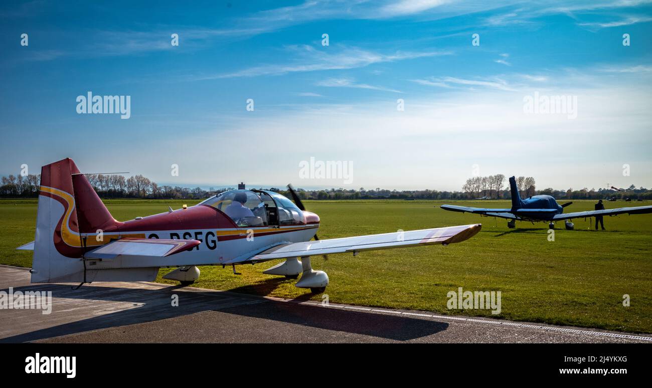 A Robin 2160 2-seater light aircraft taxis to its parking spot at ...
