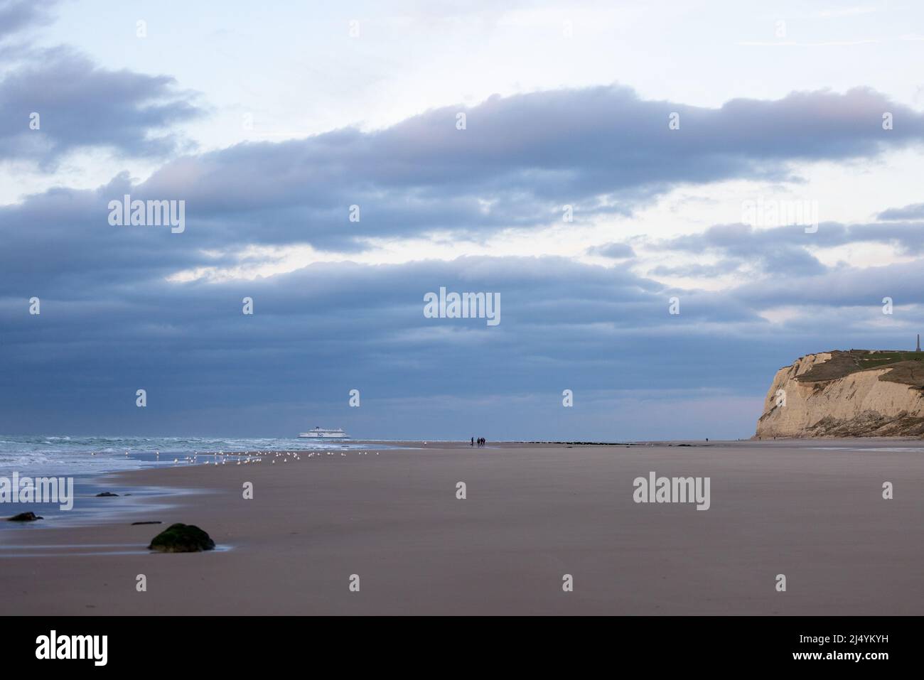 Seascape at sunset. A sunset view on the beach. Coastal view with giant ...