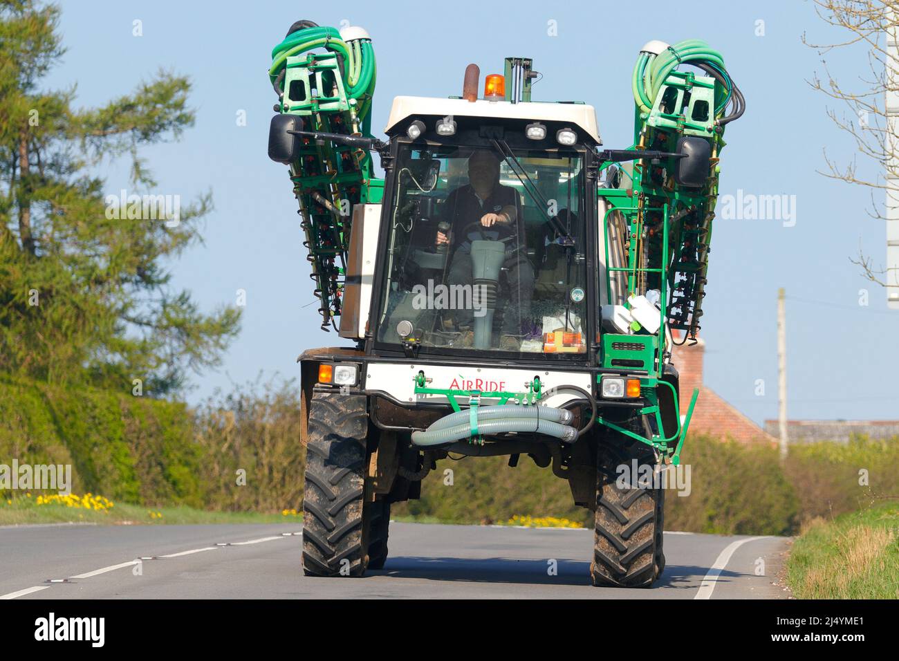 A crop spraying machine travelling along the A166 at the top of ...
