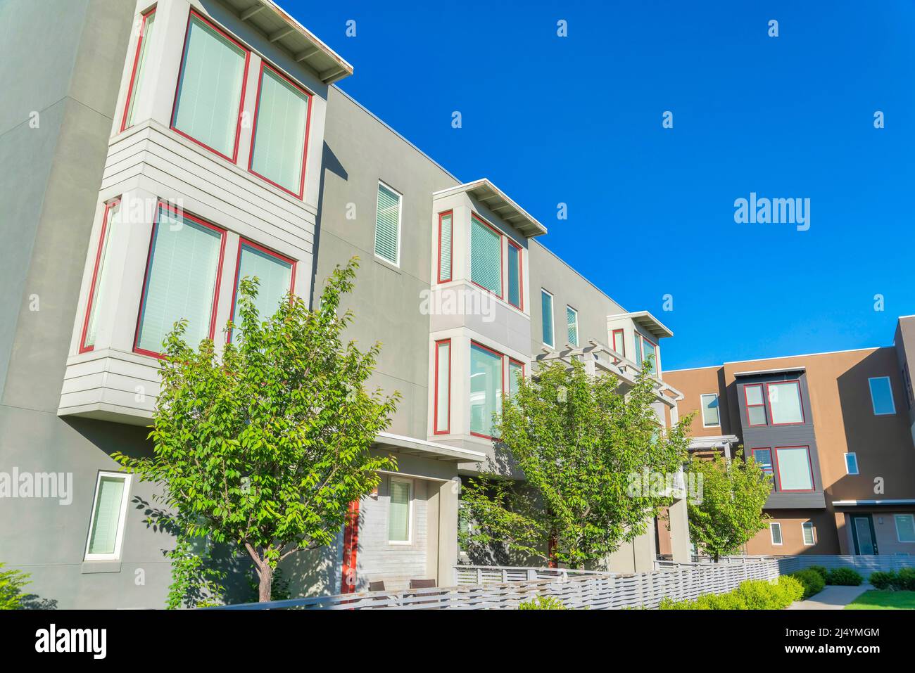 Multi-storey residential buildings with bay windows and trees at the ...