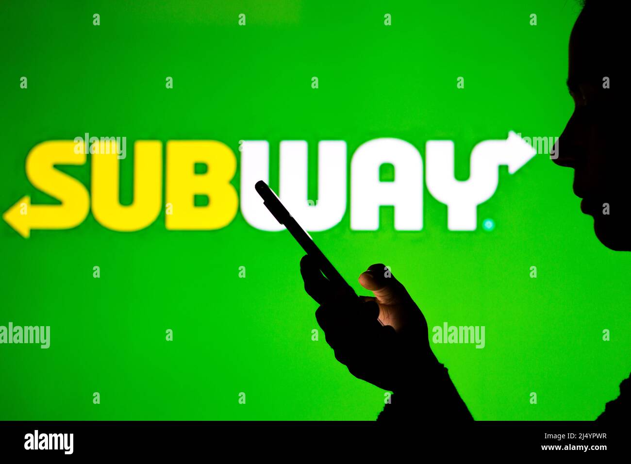 In this photo illustration the Subway logo seen in the background of a ...