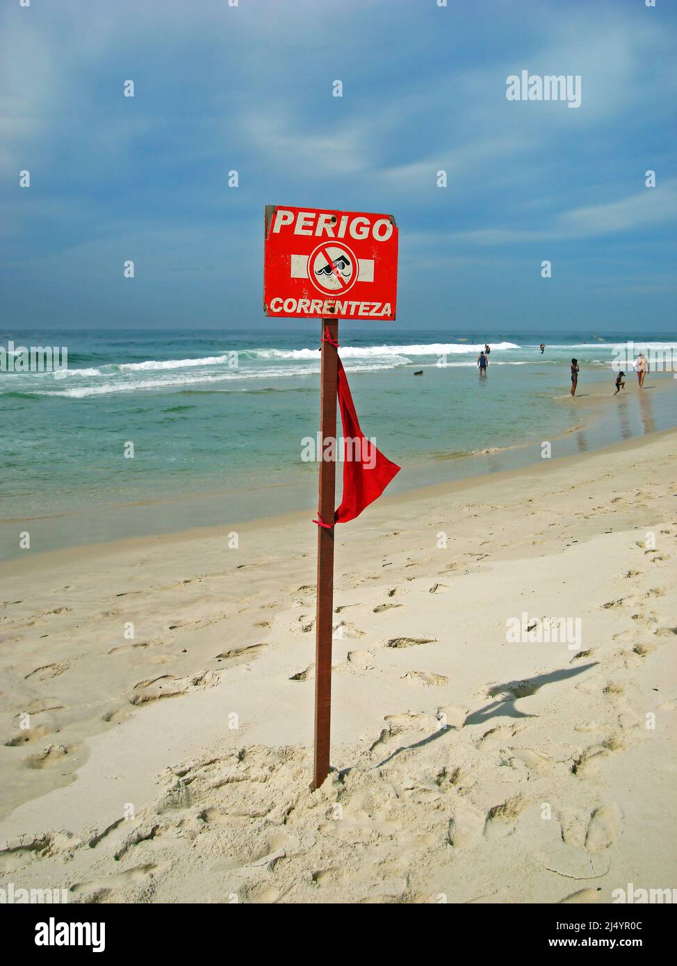 RIO DE JANEIRO, BRAZIL - FEBRUARY 4, 2007: Red warning sign and flag at ...