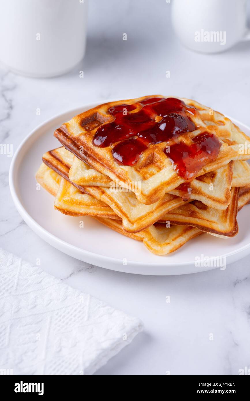 Homemade delicious belgian waffles on the white table Stock Photo - Alamy