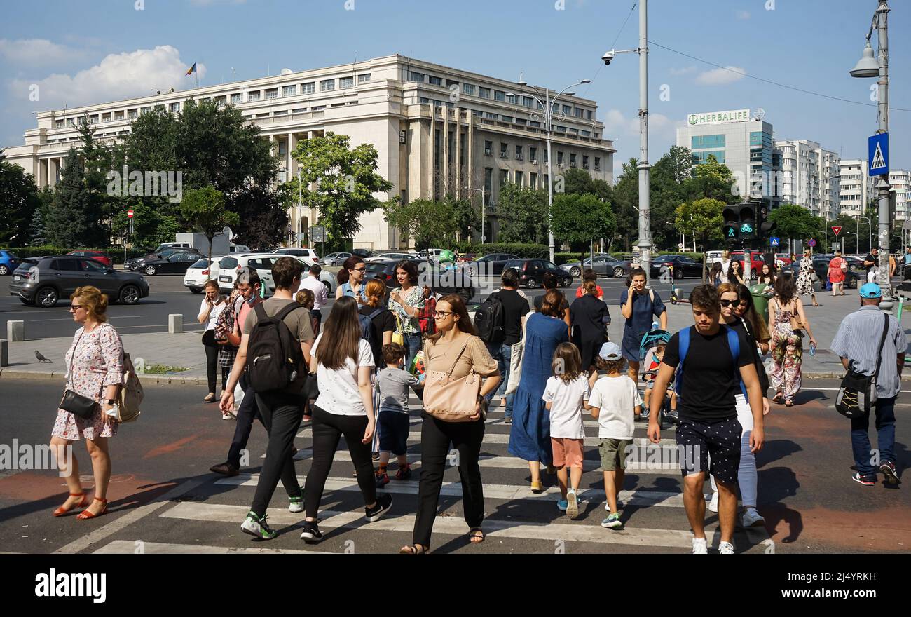 Bucharest, Romania - July 14, 2021: People cross the street near the ...