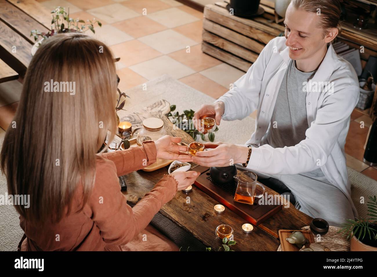 People drinking tea in traditional Chinese ceremony Gun Fu Cha Stock ...