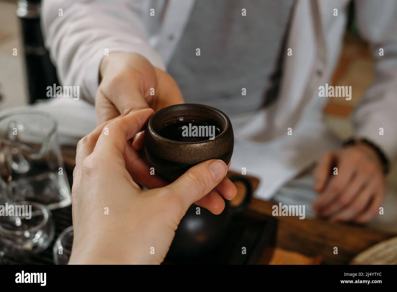 Drinking tea in traditional Chinese ceremony Gun Fu Cha Stock Photo - Alamy
