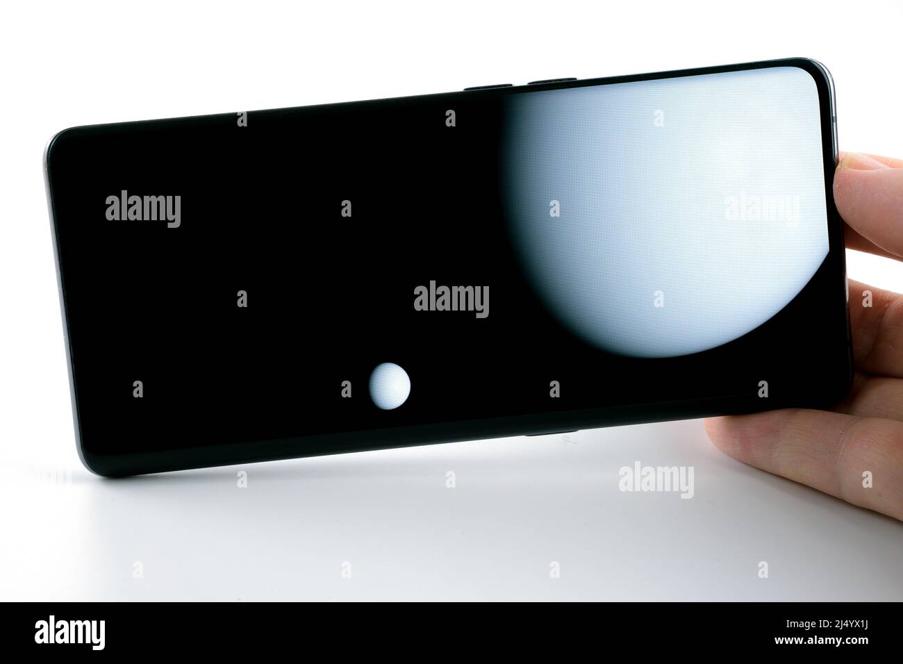 Smartphone with the NFT Merge digital art by Murat Pak. The most ...