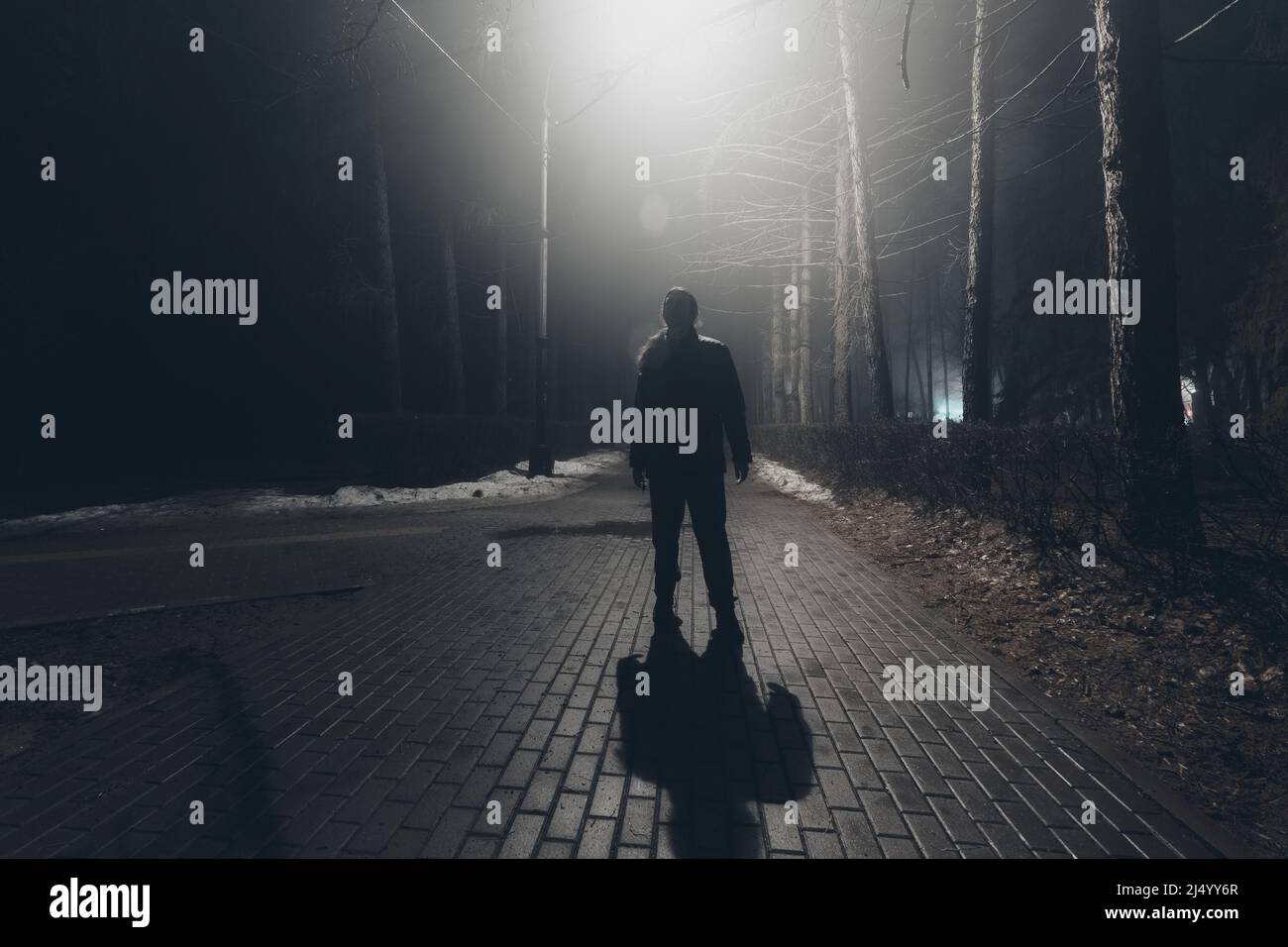 Man Walking At Night