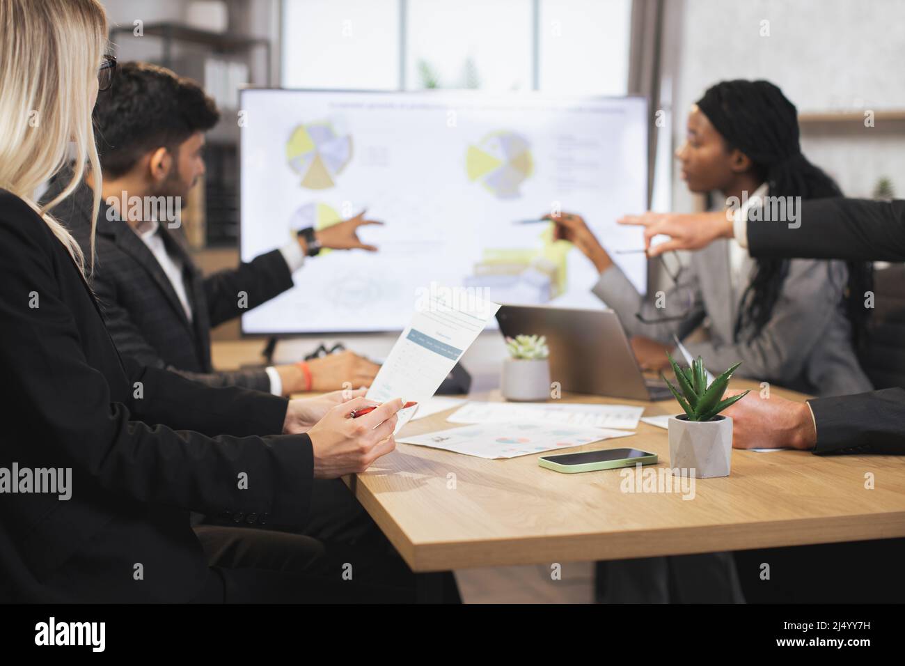 Close up cropped shot of diverse business team, having meeting in ...