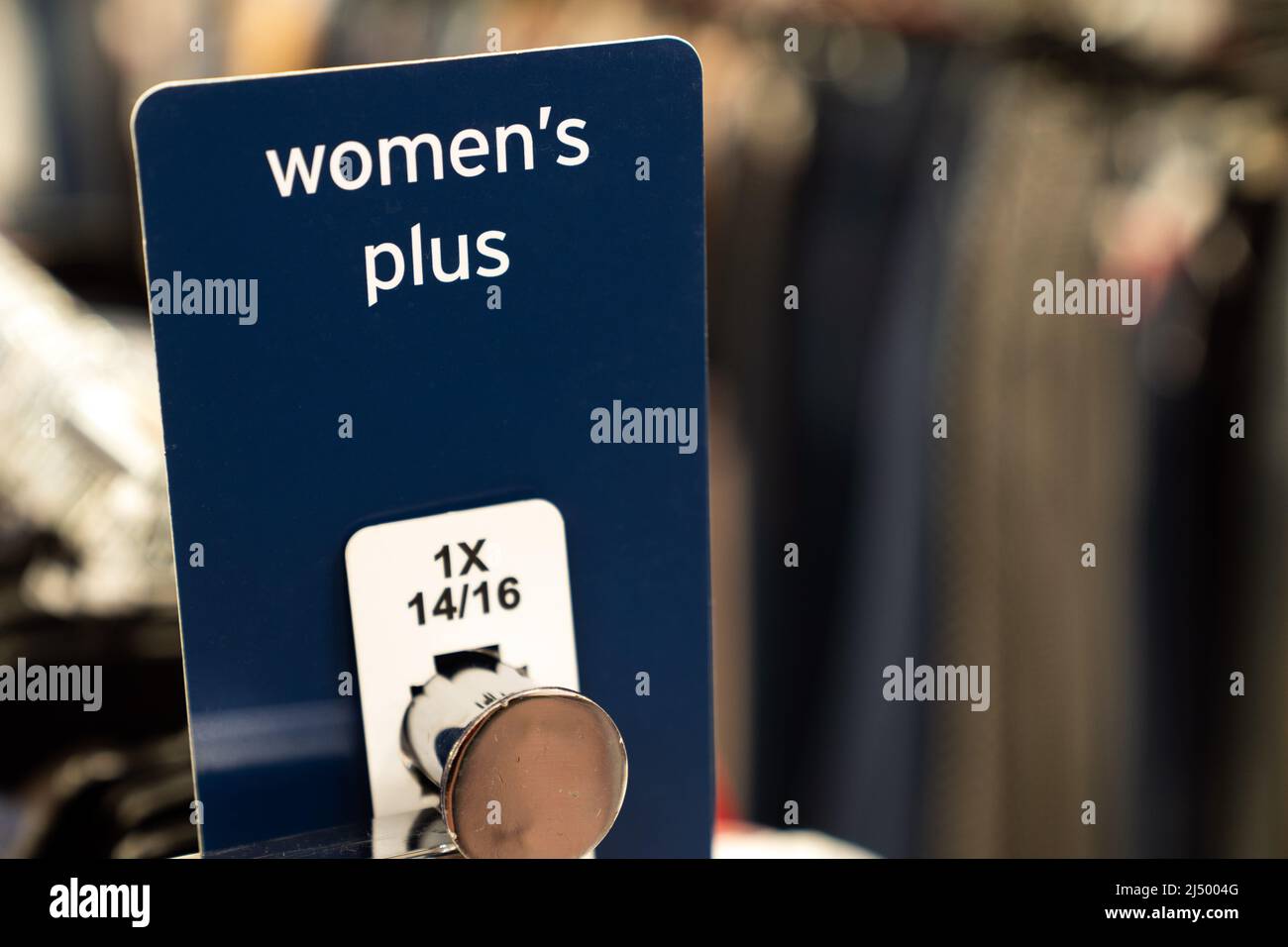 Woman's plus size label in the clothing department Stock Photo - Alamy