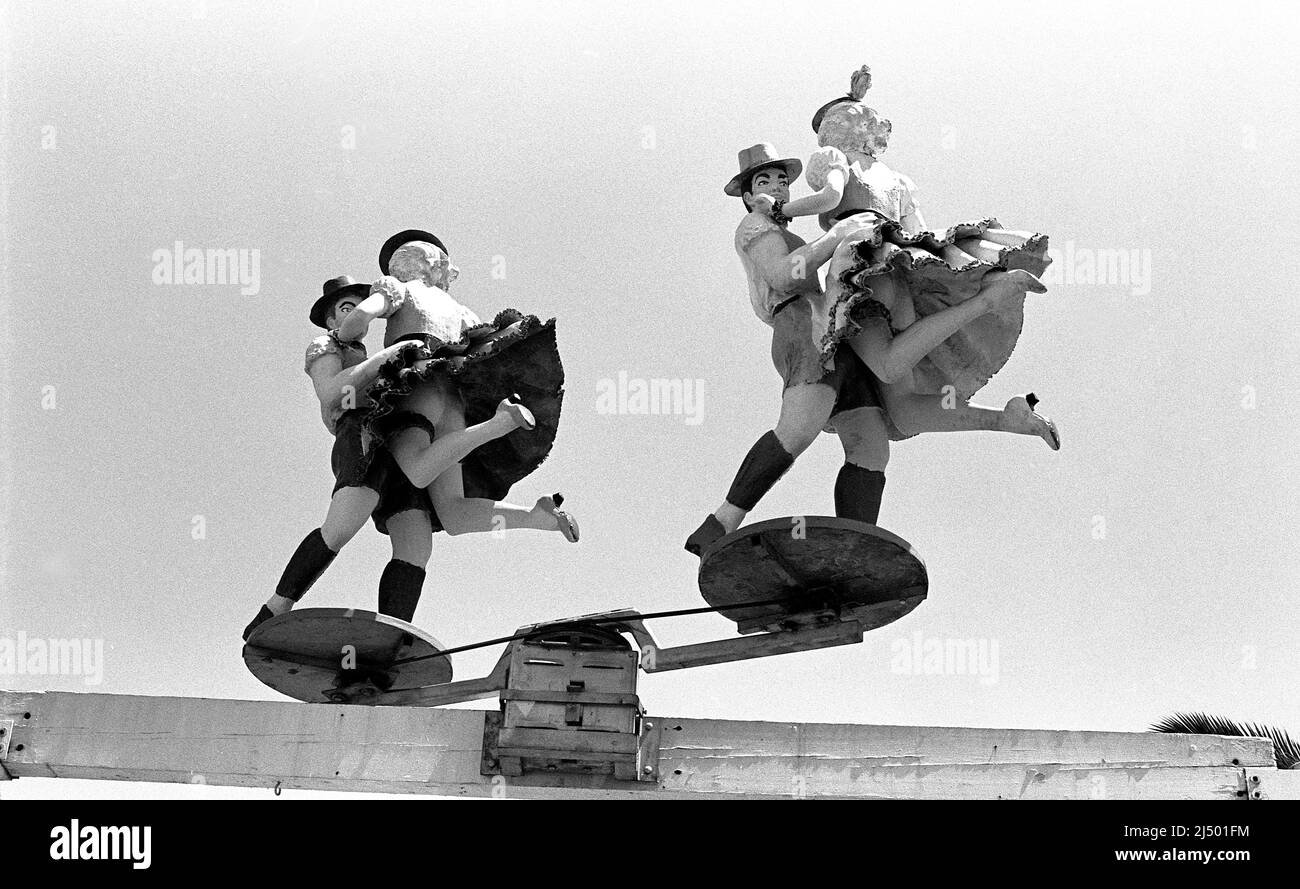 Carved wooden figures of Tyrolean dancers adorning a ride at the now ...