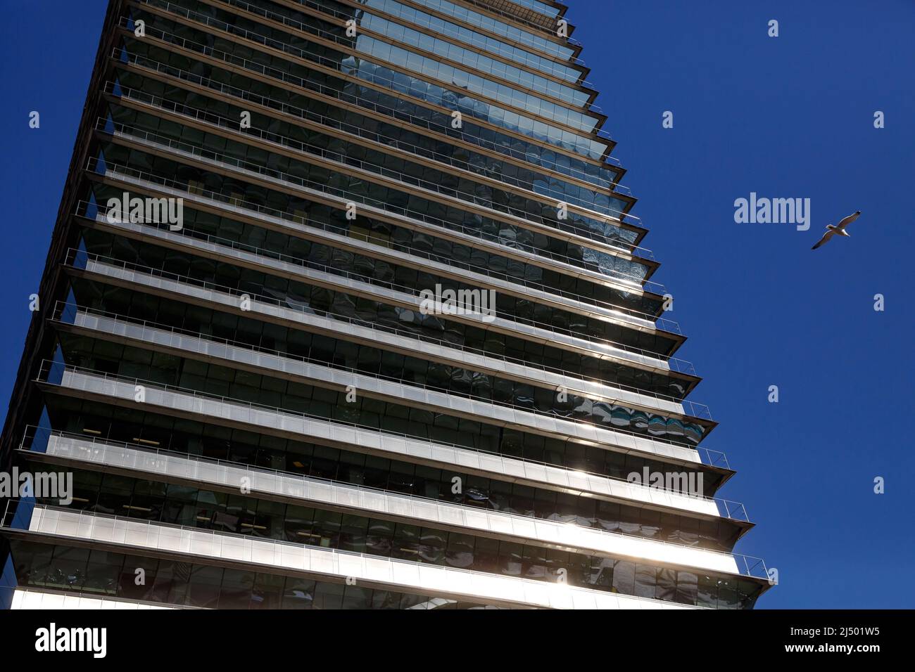 Balconies of modern glass building skyscrapers Stock Photo - Alamy