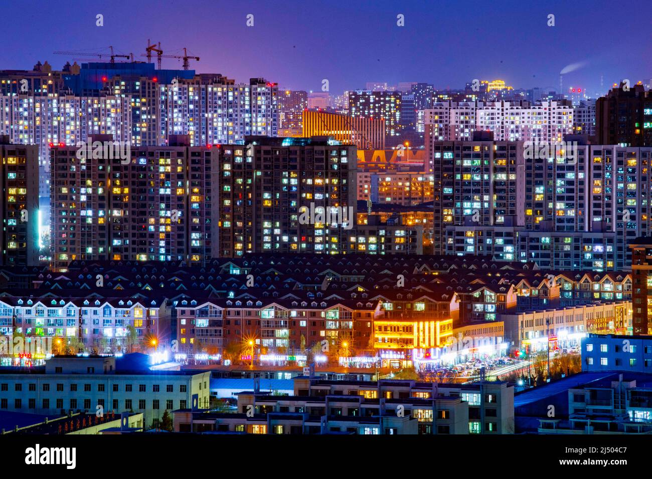 HOHHOT, CHINA - APRIL 18, 2022 - Lights at night in a residential area ...