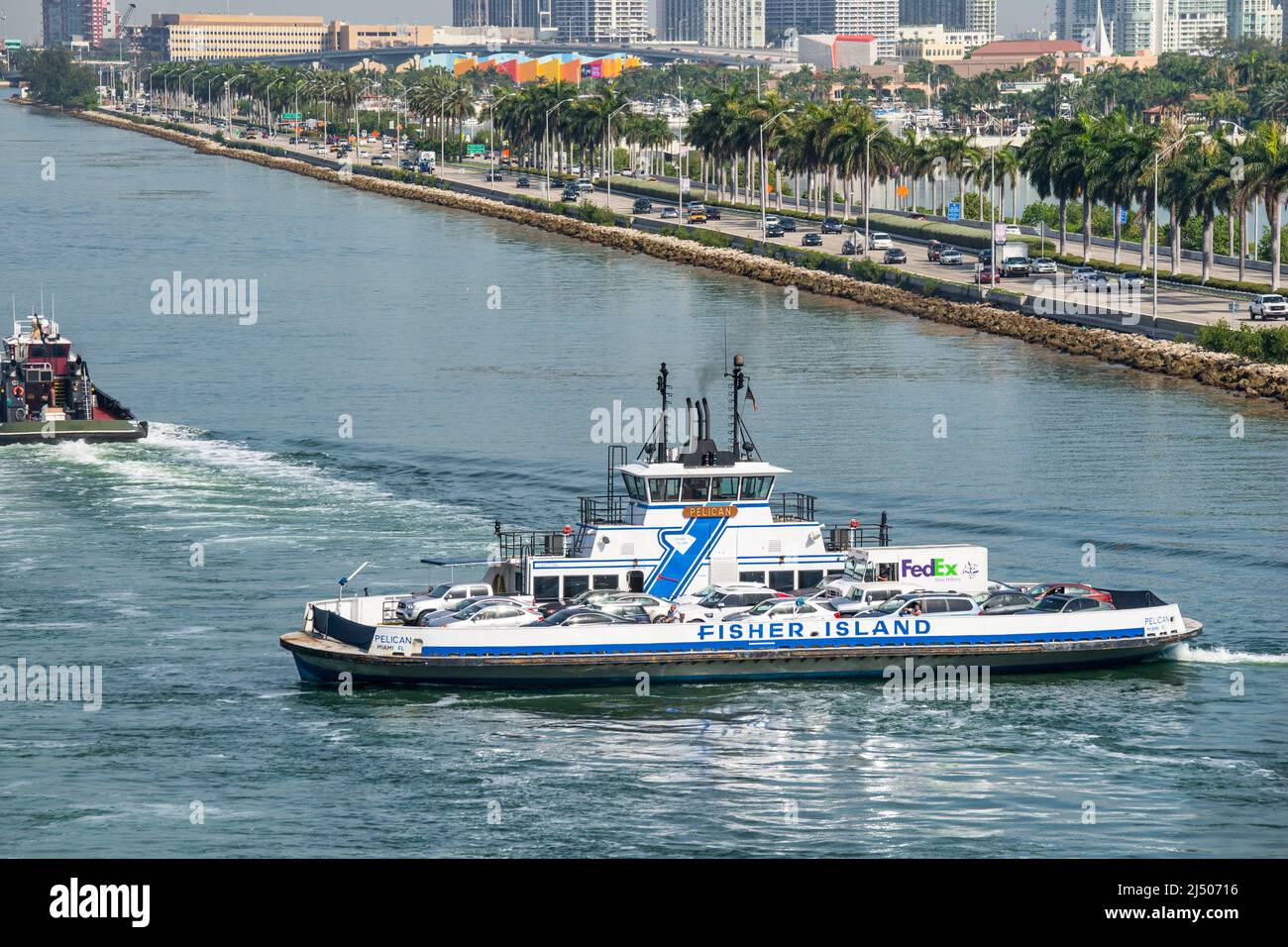The Fisher Island Ferry crosses another boat’s wake in Government Cut ...