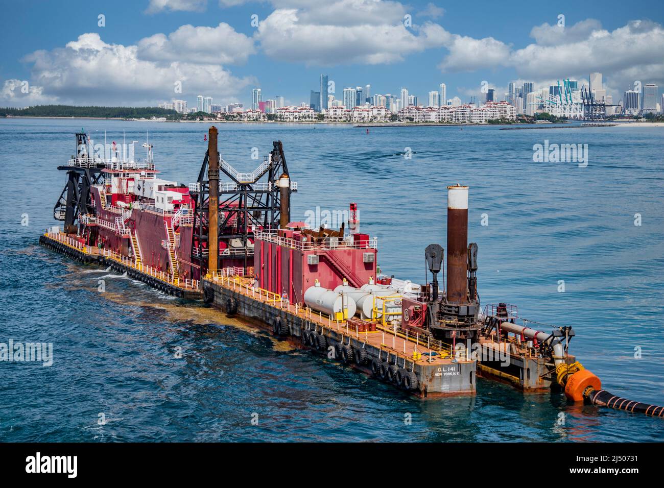 A dredge boat working off the coast of Miami Beach seen from a cruise ...