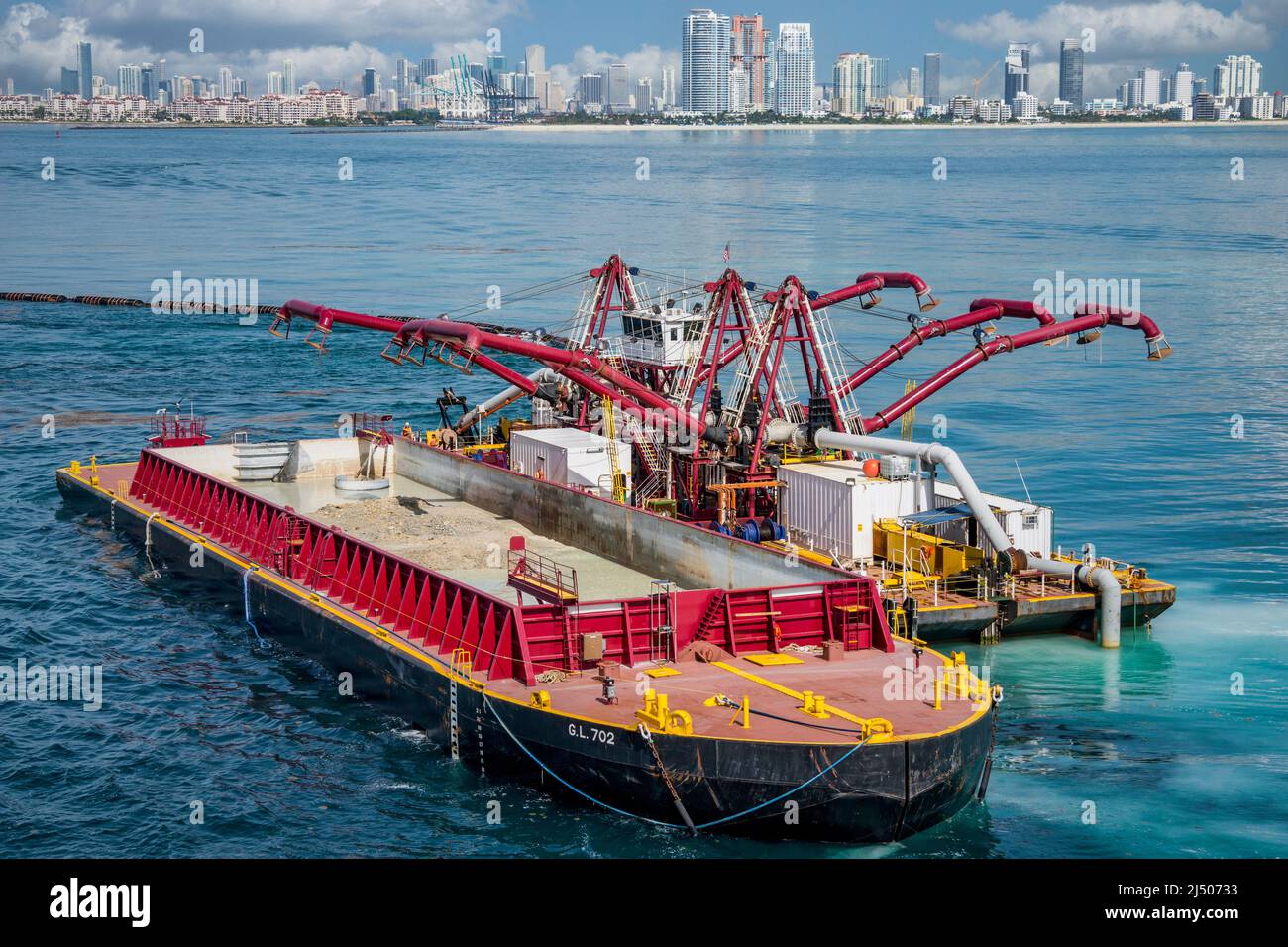 Dredging barges working off the coast of Miami Beach seen from a cruise ...