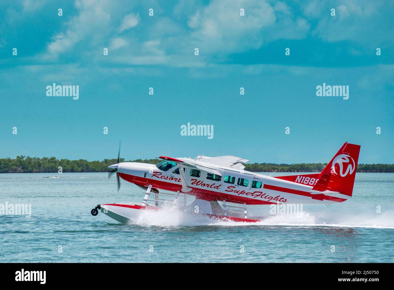 A seaplane taking off from the waters by Bimini in the Bahamas Stock ...