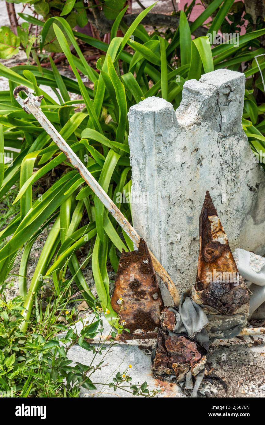 A rusted anchor and weathered conch shells outside the Bimini Museum on ...