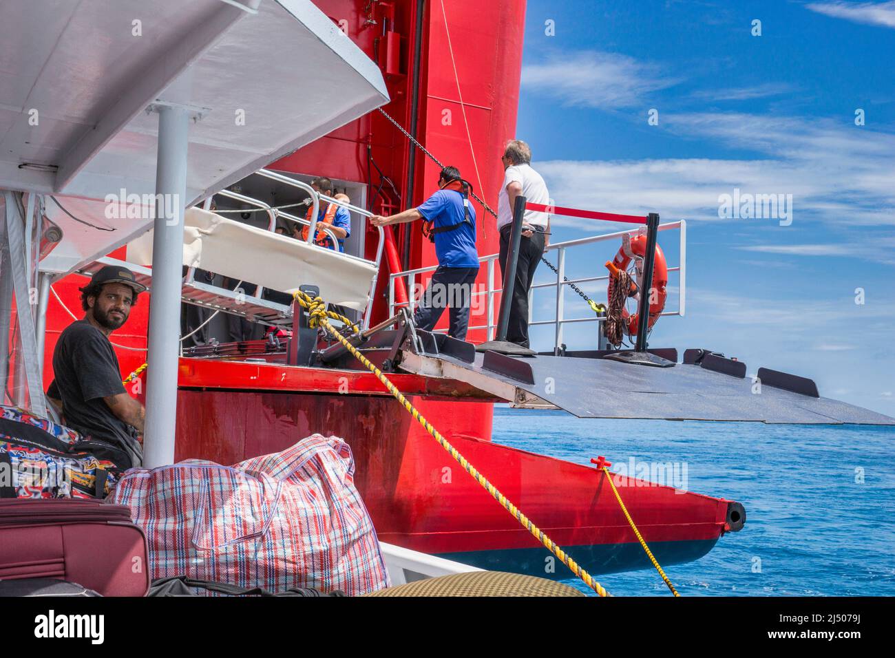 The crew works to load the passenger tenders from the Bimini SuperFast ...