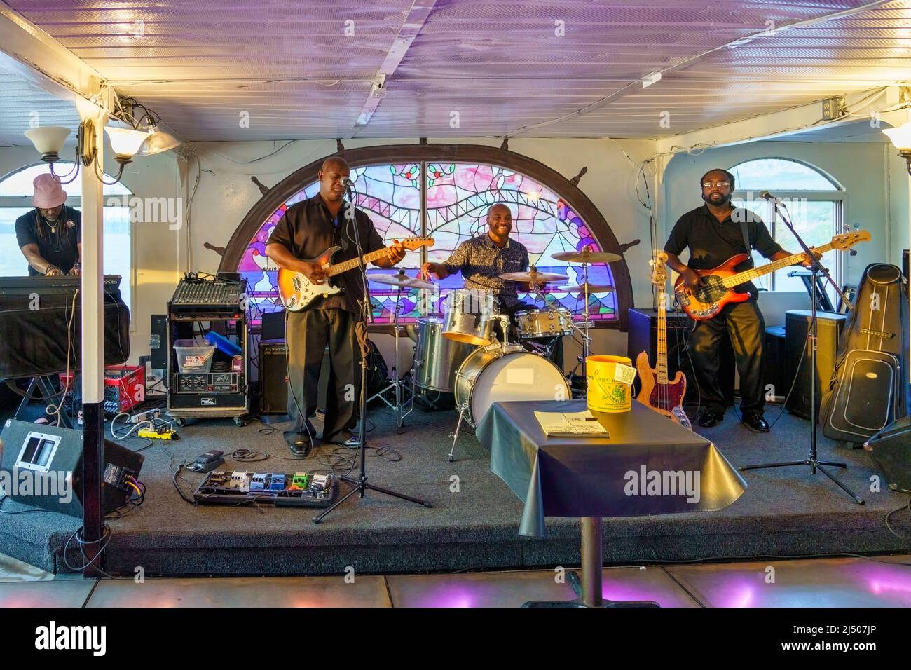 A jazz band plays during a dinner cruise along the Mississippi River on ...