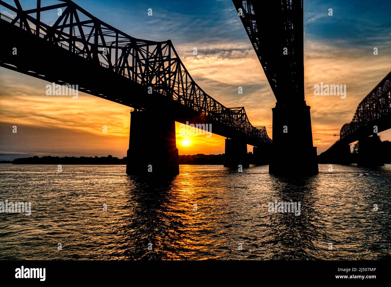 The sun sets over the Arkansas shore by the I55, Harahan and Frisco ...