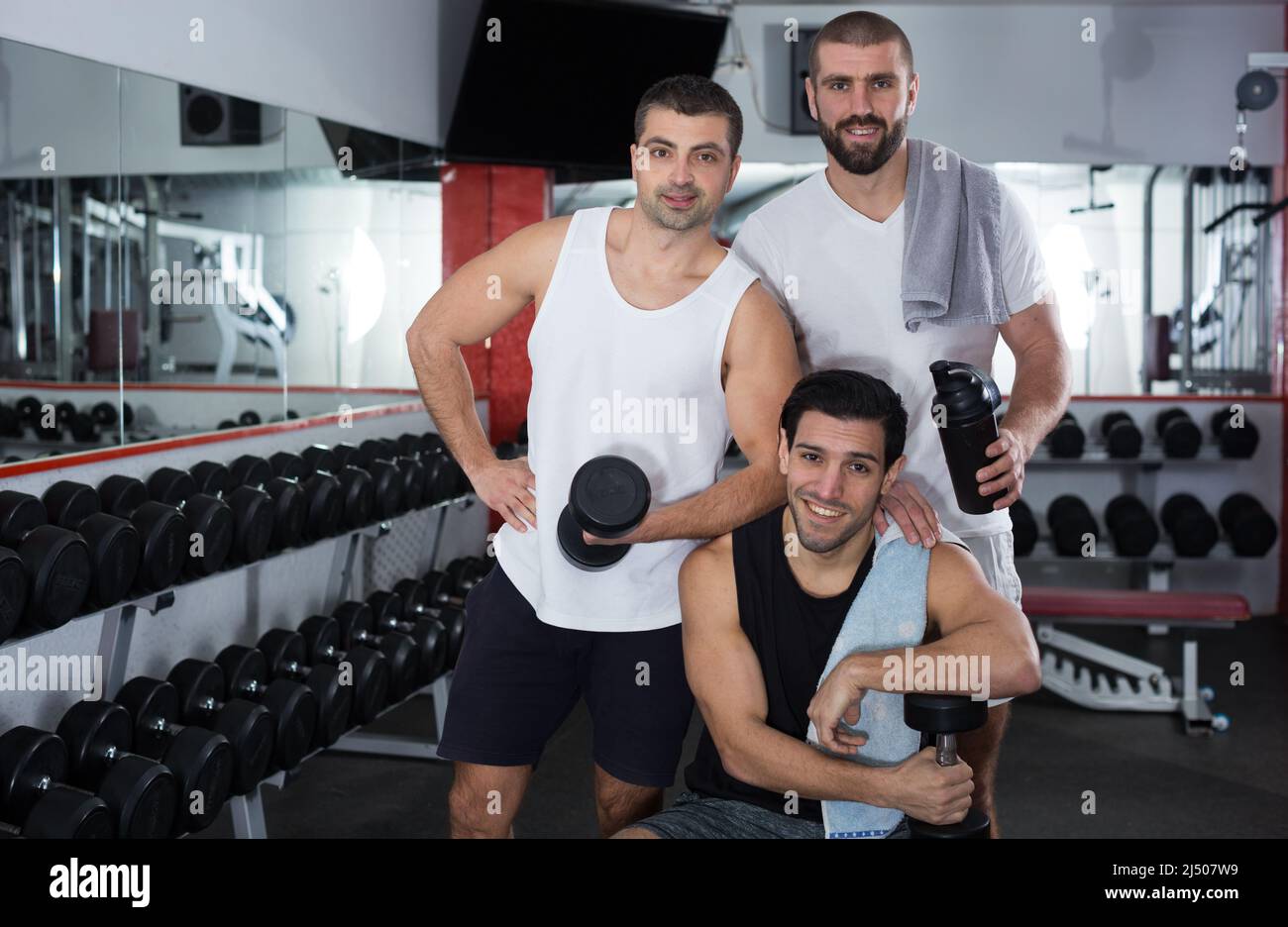 Three men in gym Stock Photo - Alamy