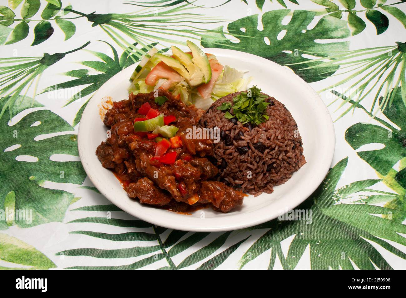 Cuban rice dish known as Chivo Con Moro Negro Stock Photo - Alamy