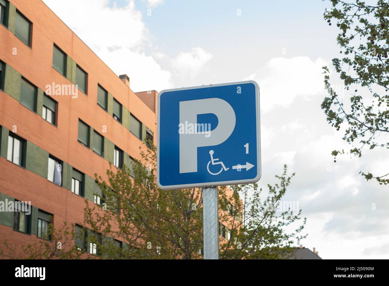 disabled parking sign outside street Stock Photo - Alamy