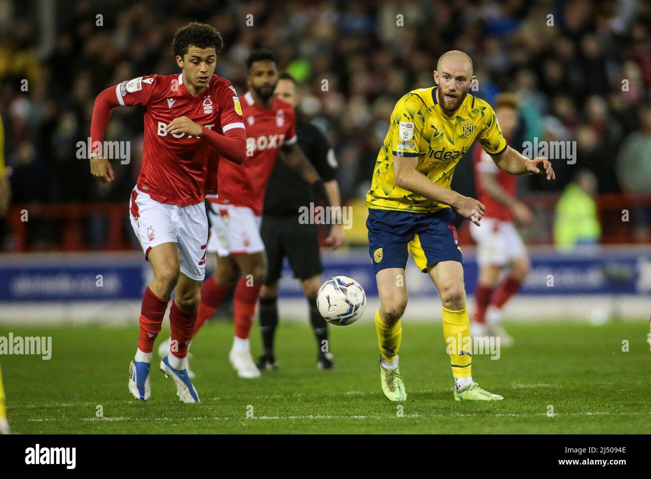Nottingham, UK. 18th Apr, 2022. Callum Robinson of WBA clears from Ryan ...