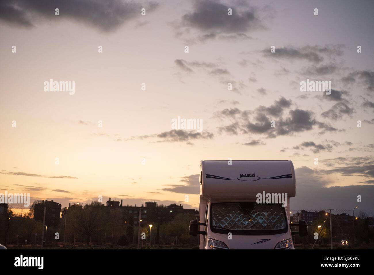 caravan in car park at sunset Stock Photo - Alamy