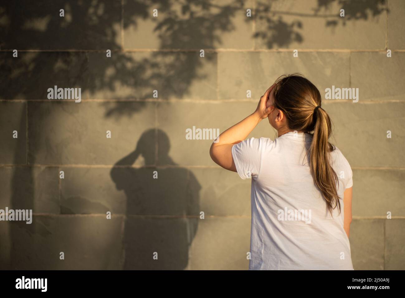 Young female health related poses with shadows Stock Photo - Alamy