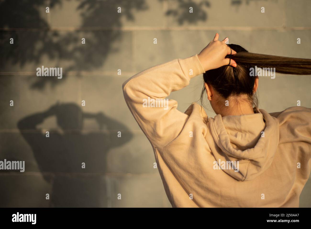 Young female health related poses with shadows Stock Photo - Alamy