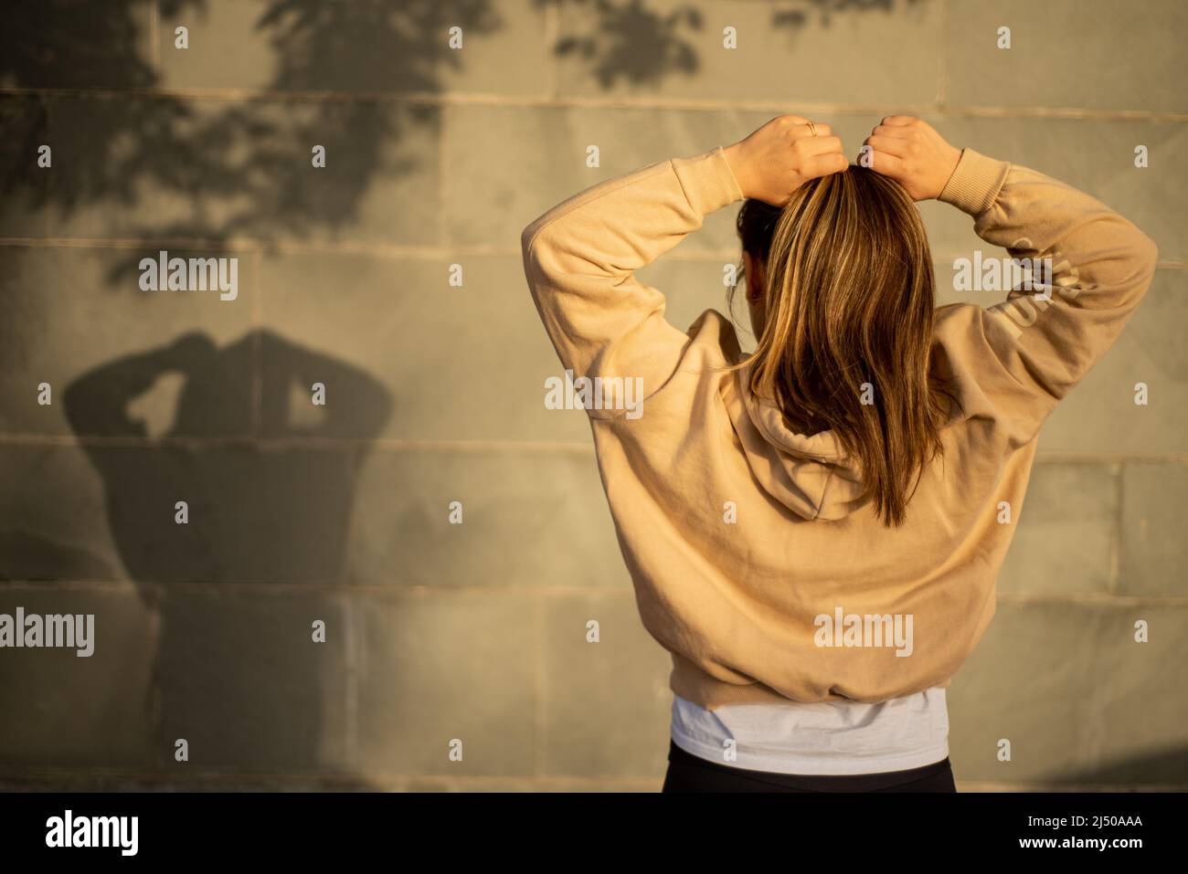Young female health related poses with shadows Stock Photo - Alamy