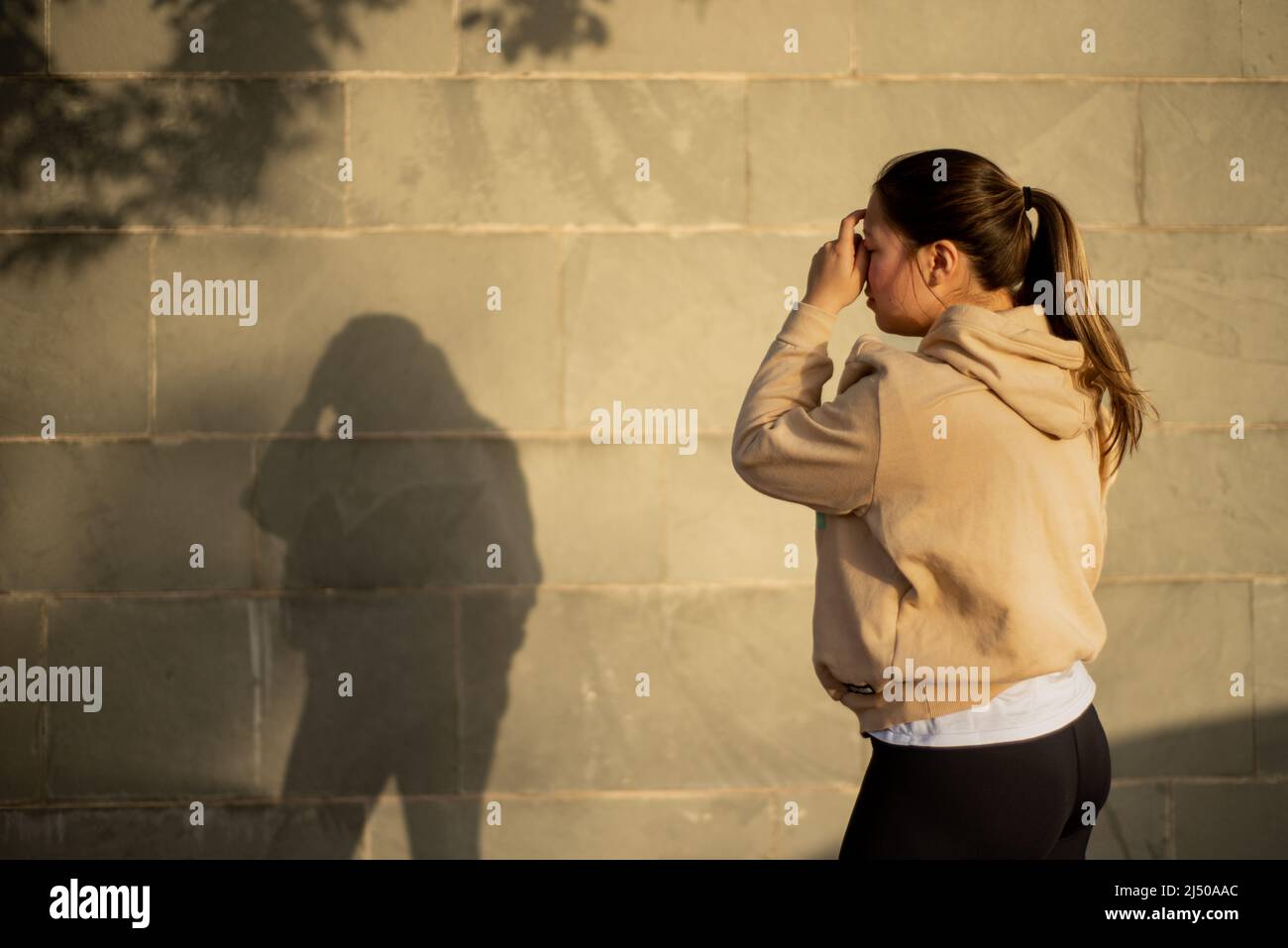 Young female health related poses with shadows Stock Photo - Alamy