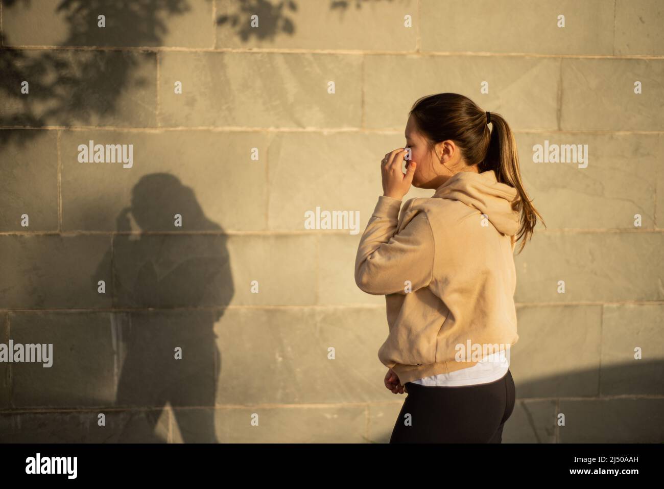 Young female health related poses with shadows Stock Photo - Alamy