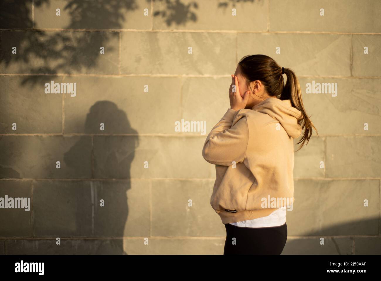 Young female health related poses with shadows Stock Photo - Alamy