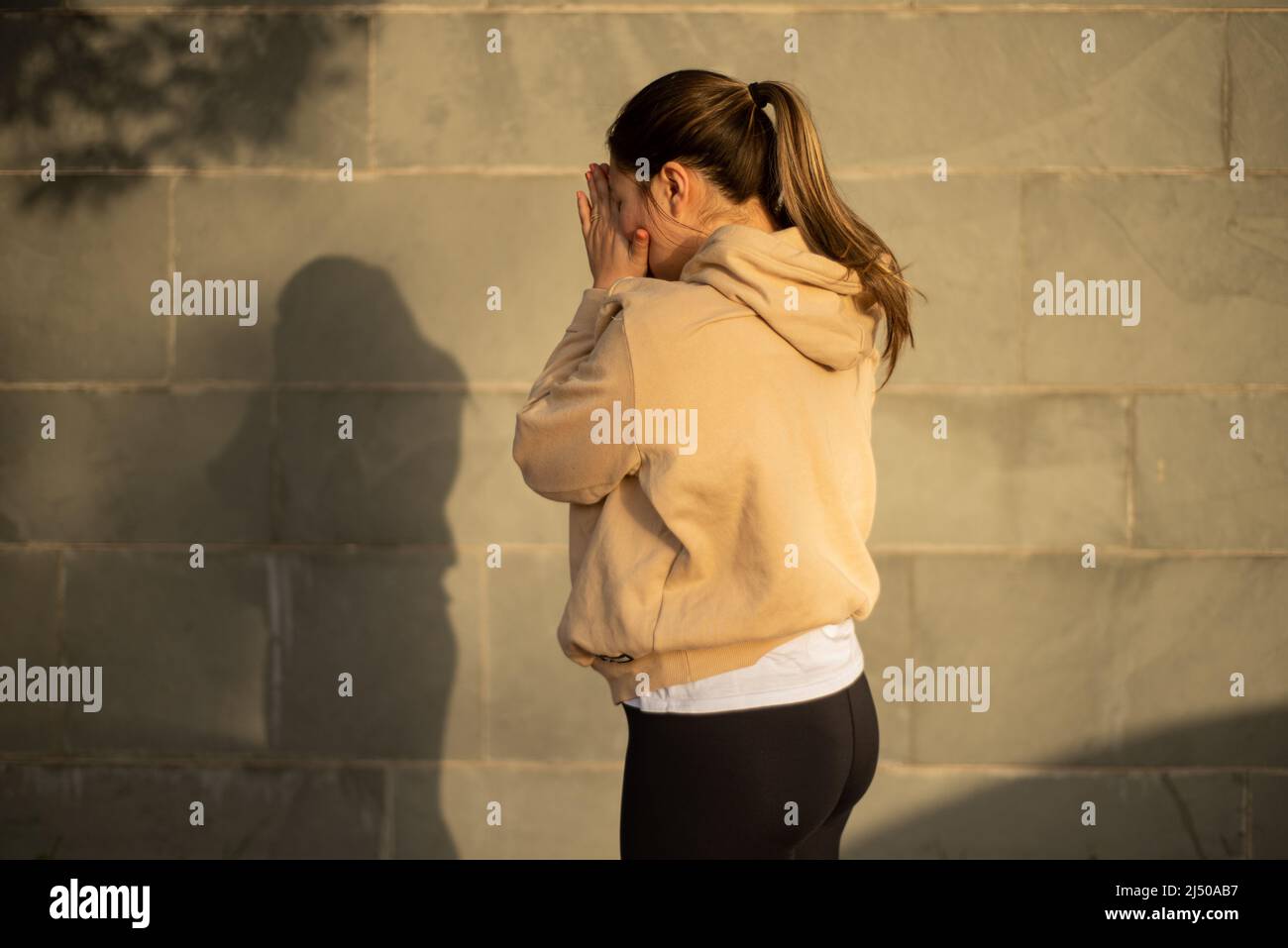 Young female health related poses with shadows Stock Photo - Alamy