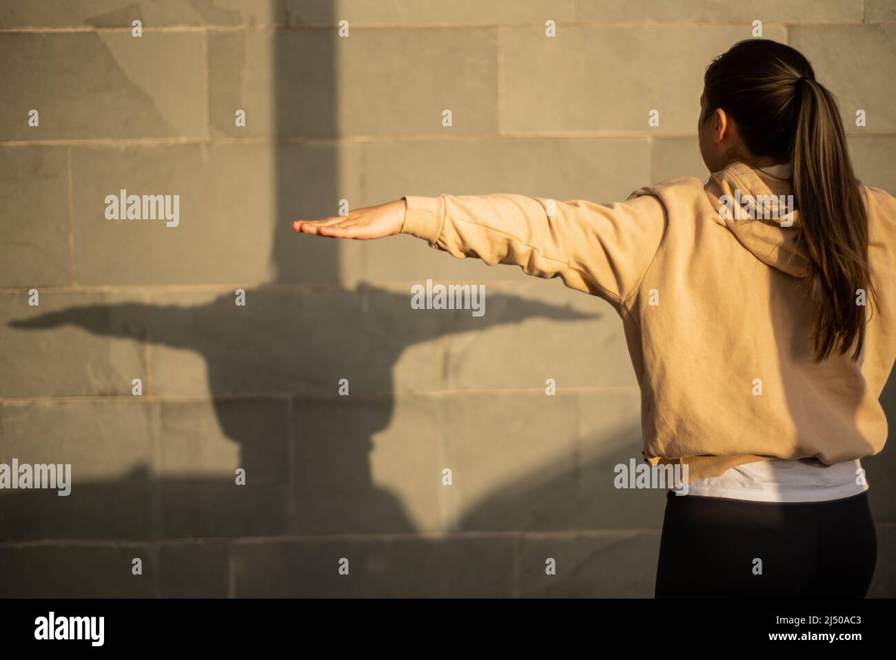 Young female health related poses with shadows Stock Photo - Alamy