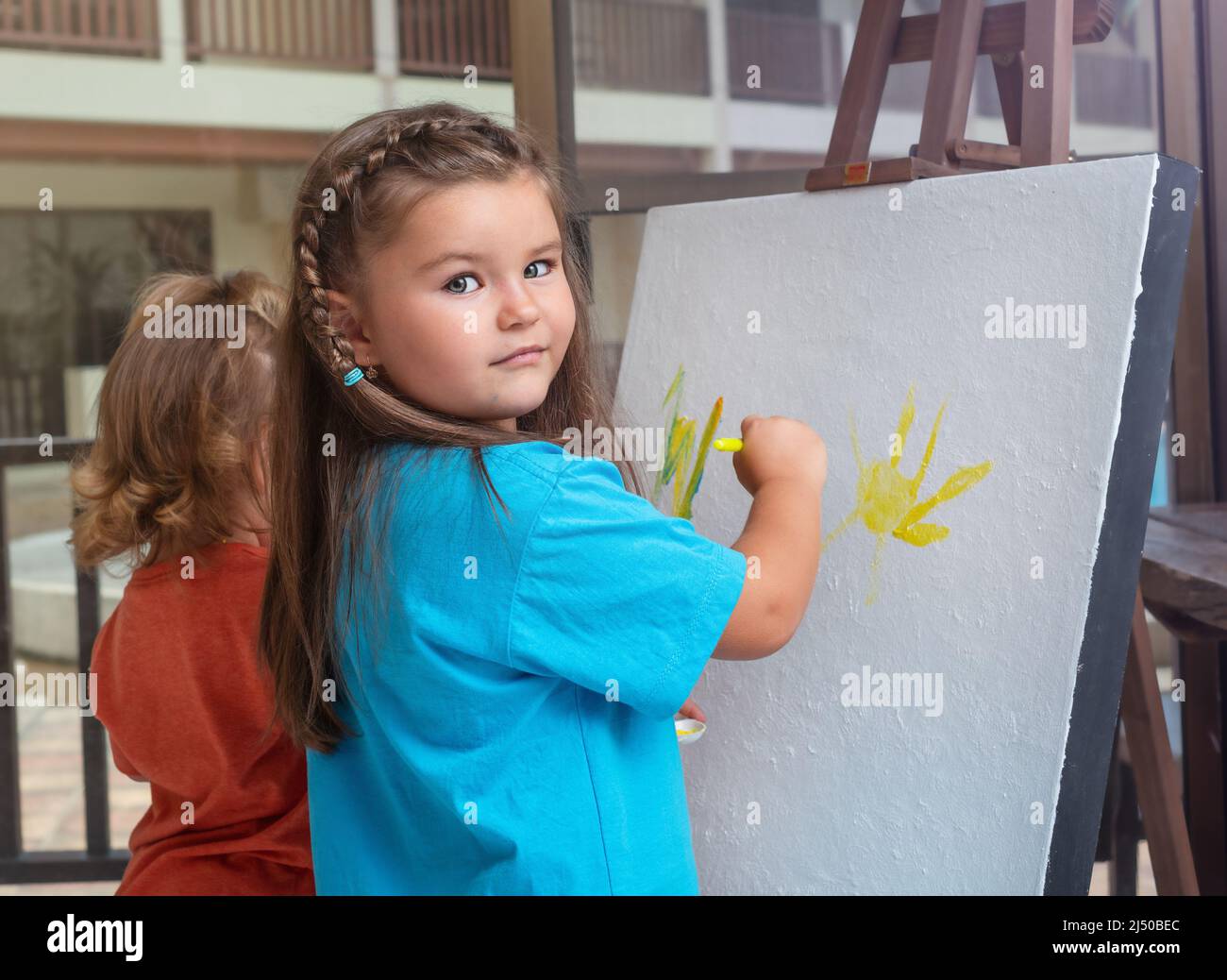 Easel paint children hi-res stock photography and images - Alamy