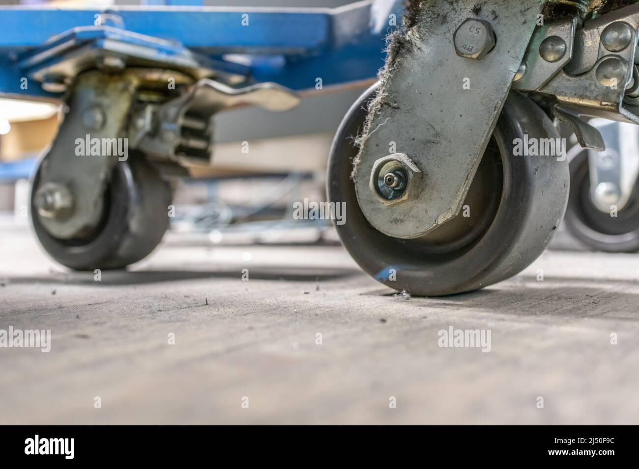 Castor - Caster wheels on factory workshop floor Stock Photo - Alamy