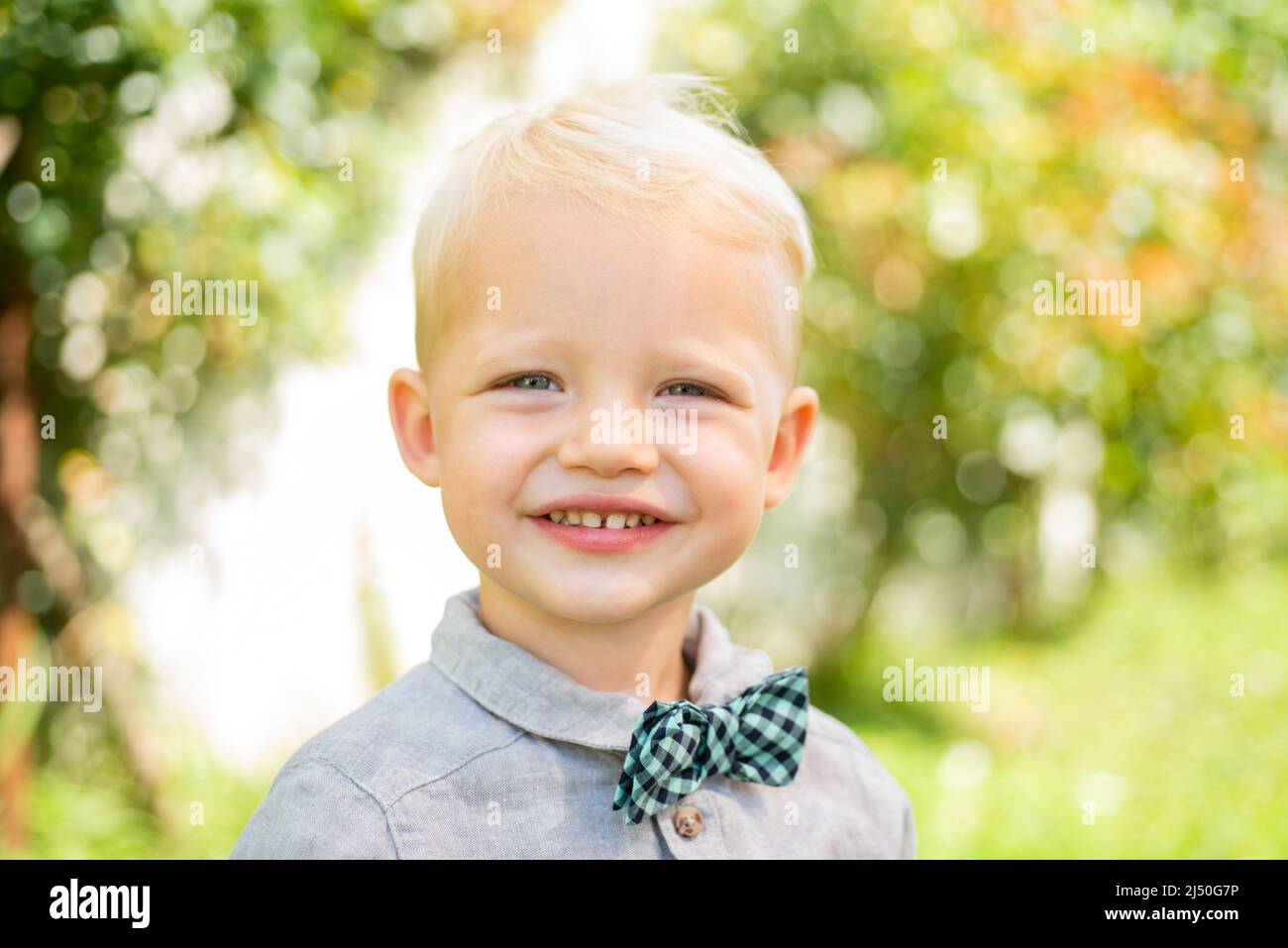 Spring kids smiling portrait. Closeup face of cute smiling spring child ...
