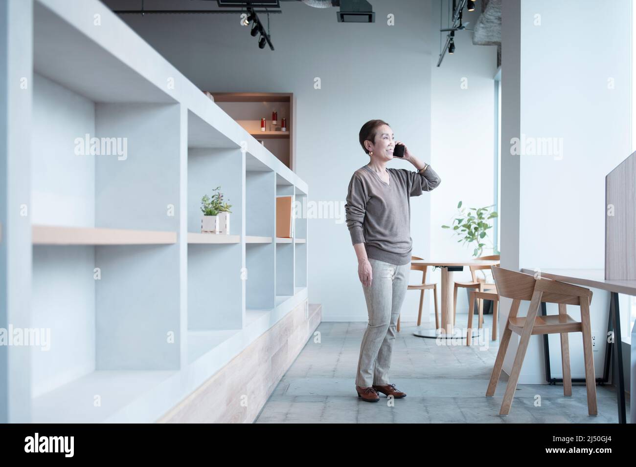 Female Administrator in Office Stock Photo - Alamy