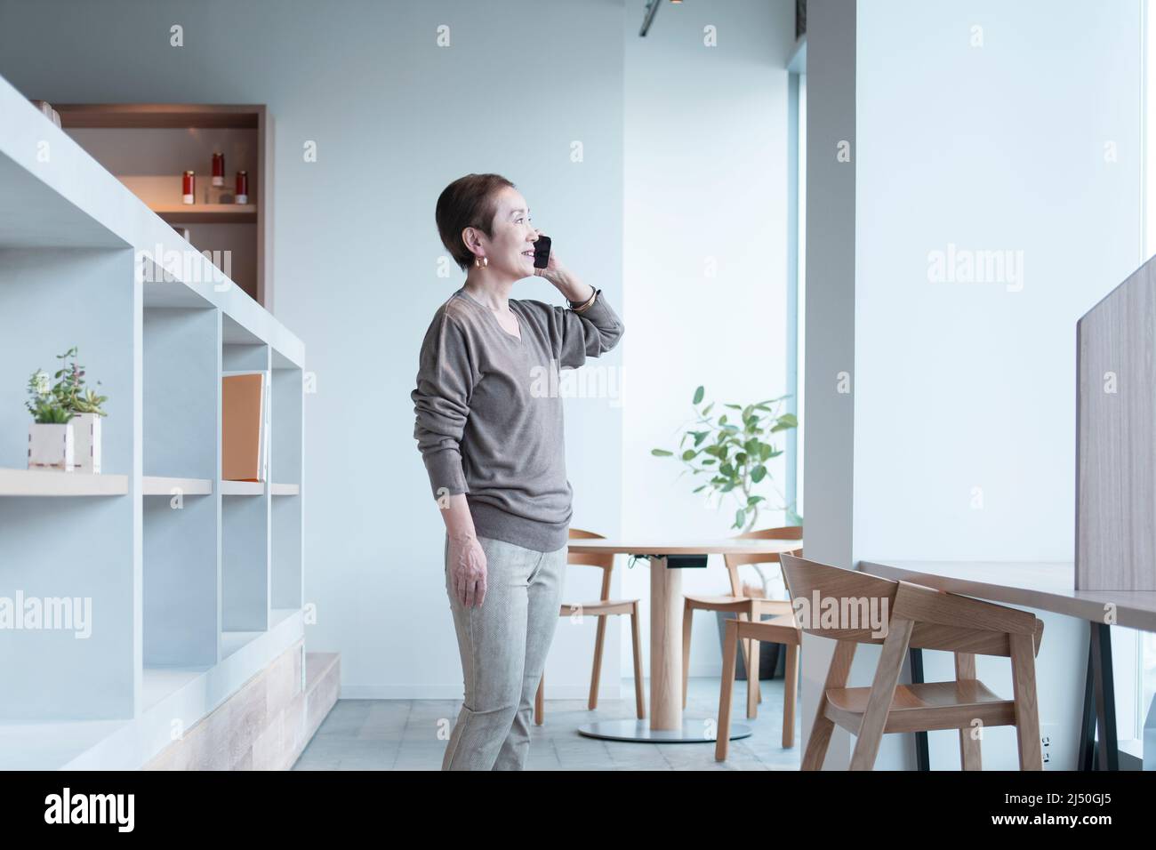 Female Administrator in Office Stock Photo - Alamy